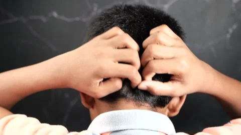 teenage boy Scratching Head Against blac... | Stock Video | Pond5