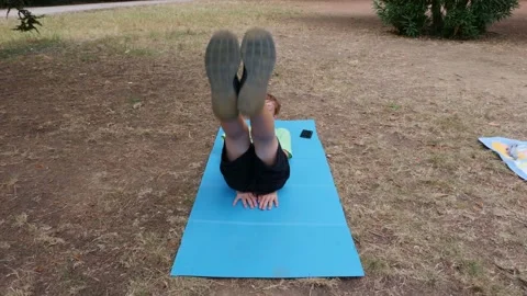 Teenage Boy sitting on a Mat in a Public... | Stock Video | Pond5