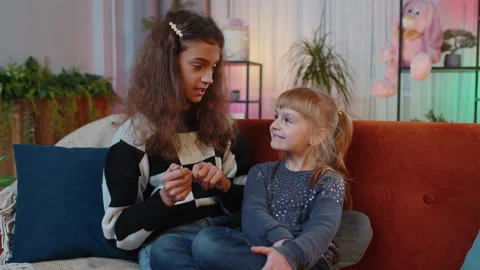 Teenage child and little sister kid chat... | Stock Video | Pond5