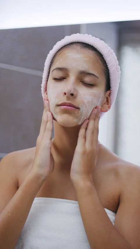 Teenage girl is cleaning up face with cl... | Stock Video | Pond5