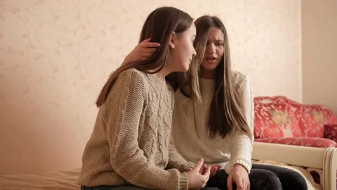 Teenage girl consoling and comforting he... | Stock Video | Pond5