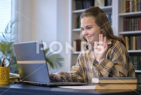Teenage girl doing homework at a desk in her bedroom. teen girl school ...