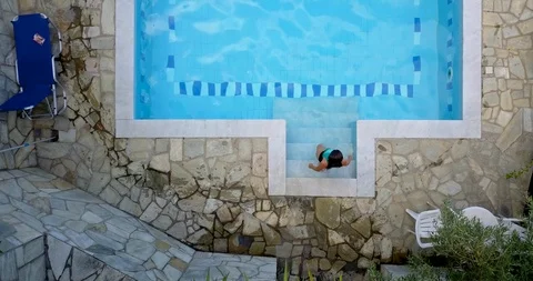 Teenage girl getting into the pool and s... | Stock Video | Pond5