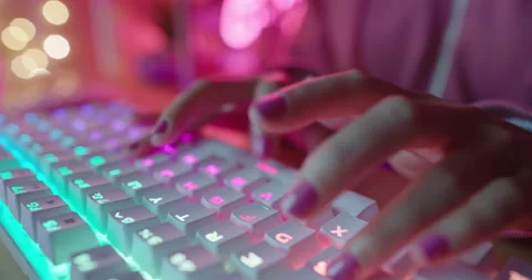 teenage girl hands typing on keyboard ga... | Stock Video | Pond5
