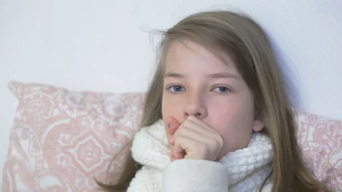 a teenage girl with signs of a cold is l... | Stock Video | Pond5