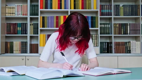 Teenage girl student with glasses studyi... | Stock Video | Pond5