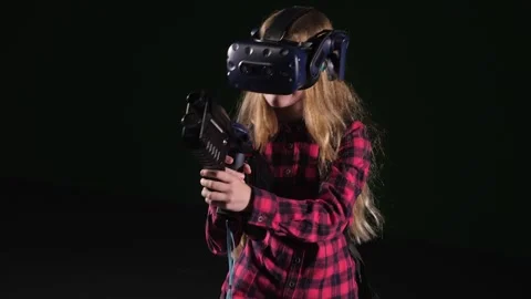 A teenage girl in VR glasses immersed in... | Stock Video | Pond5