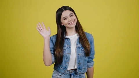 Teenage girl waving hello with hands, gr... | Stock Video | Pond5