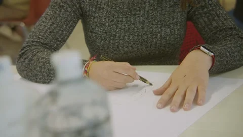 Teenager girl drawing on piece of white ... | Stock Video | Pond5