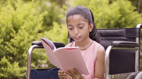 Teenager girl kid with disability readin... | Stock Video | Pond5
