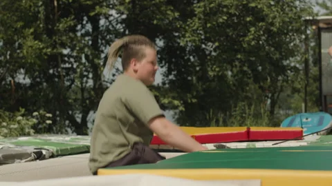 Teenager with No Legs Jumping on Trampol... | Stock Video | Pond5