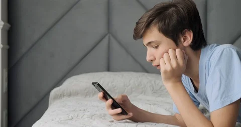 Teenager typing text message by smart ph... | Stock Video | Pond5