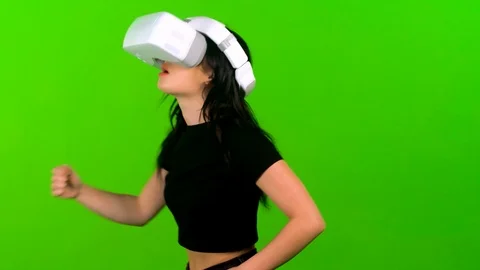 Teenager VR girl dancing happily over gr... | Stock Video | Pond5