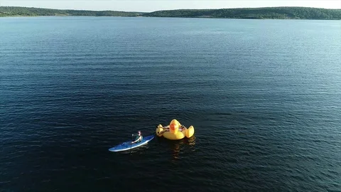 Teenagers having fun on a lake with kaya... | Stock Video | Pond5