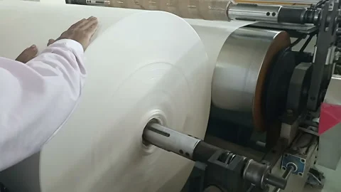 Tehnician checking tension of paper roll... | Stock Video | Pond5