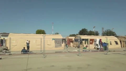 Temporary housing pods for Afgan refugee... | Stock Video | Pond5