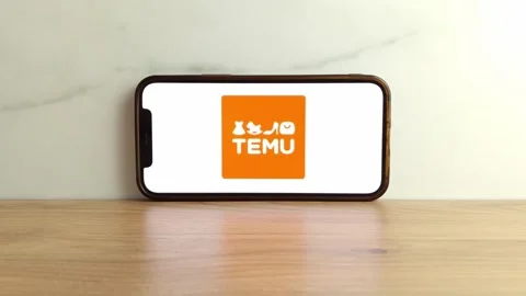 Temu logo displayed on mobile phone | Stock Video | Pond5