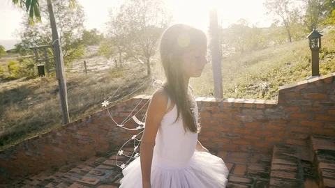 Tender girl with small wings climbing th... | Stock Video | Pond5