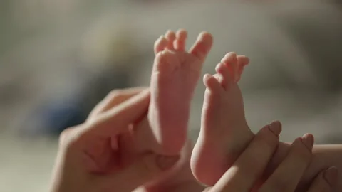 Tender touch of mother's hand on her new... | Stock Video | Pond5