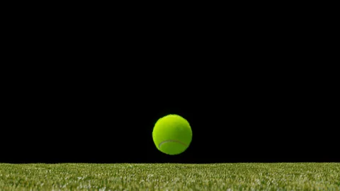 Tennis ball bounces on green lawn tennis... | Stock Video | Pond5