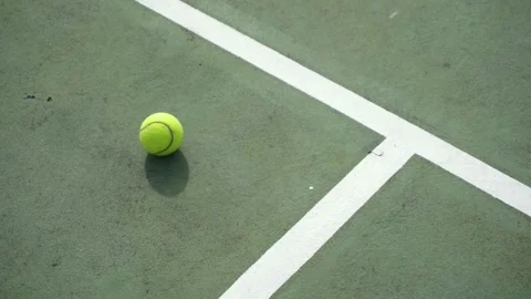 Tennis ball rolling to a stop on the cou... | Stock Video | Pond5