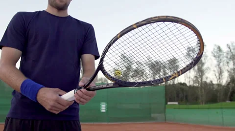 Tennis Player's Hand Rolls Tennis Racket... | Stock Video | Pond5