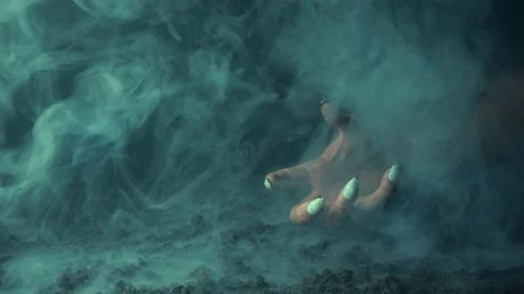 A terrible hand with claws emerges from ... | Stock Video | Pond5