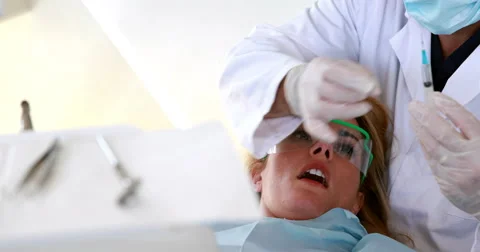 Terrified patient looking at needle in d... | Stock Video | Pond5