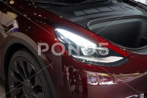 Tesla car model Y in cherry red color in Studio, electric vehicle in ...