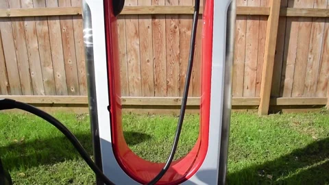 Tesla Charger at a Tesla EV charging sta... | Stock Video | Pond5
