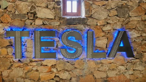 Tesla logo with blue lighting on brick w... | Stock Video | Pond5