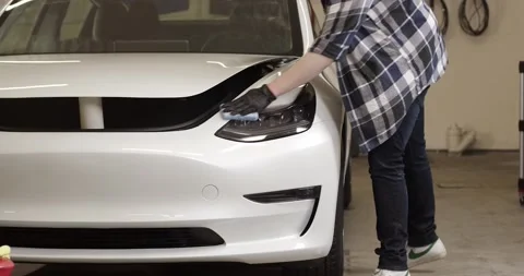 Tesla Model 3 gets a ceramic coating to ... | Stock Video | Pond5