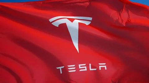 Tesla Motors Inc. flag in slow motion, e... | Stock Video | Pond5