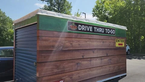 Texas Roadhouse Drive Thru to Go Semi | Stock Video | Pond5