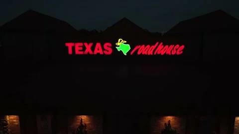 Texas Roadhouse restaurant sign lit at n... | Stock Video | Pond5