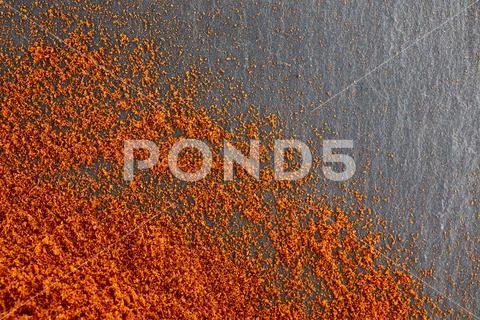 Photograph: Texture background. Red chilli pepper powder. Top view ...