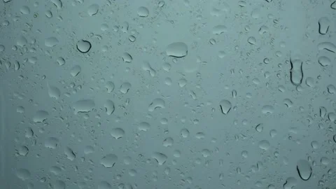 Texture on glass from rain drops. Fallin... | Stock Video | Pond5