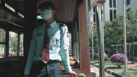 Thai security guard stand by the bus sta... | Stock Video | Pond5