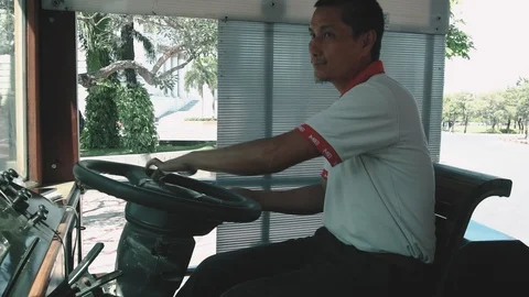 Thai shuttle bus driver driving a bus - ... | Stock Video | Pond5