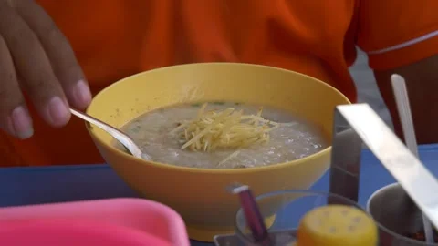 thailand guest eating chinese rice conge... | Stock Video | Pond5