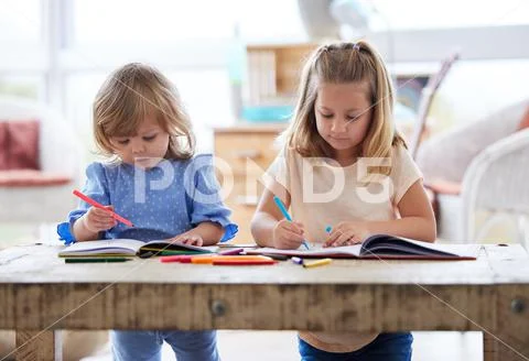 Photograph Theres So Much To Draw Two Little Sisters Drawing At Home