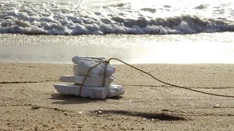 Thermocol Fishnet Float on beach sand wi... | Stock Video | Pond5