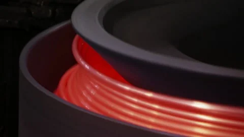 Thick Bright Orange Metal Wire is Coiled... | Stock Video | Pond5