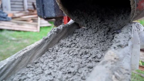 Thick concrete mortar flows down from th... | Stock Video | Pond5