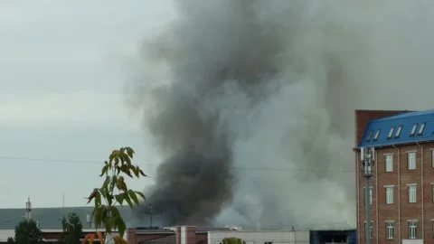 Thick smoke from a large fire in a resid... | Stock Video | Pond5