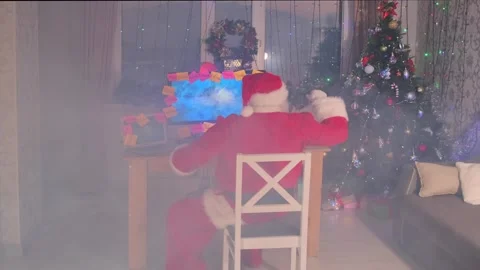 In thick smoke Santa typing on keyboard ... | Stock Video | Pond5