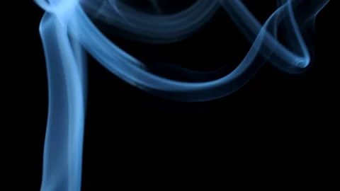 Thin trickle of blue smoke slowly rising... | Stock Video | Pond5