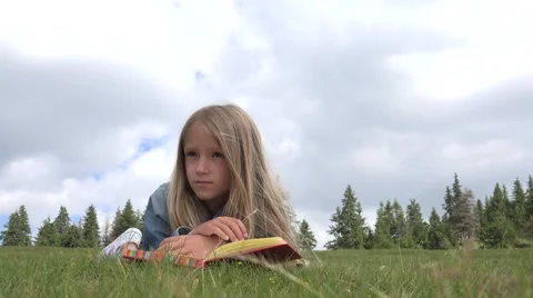 Thinking Sad Child Reading a Book on Mea... | Stock Video | Pond5