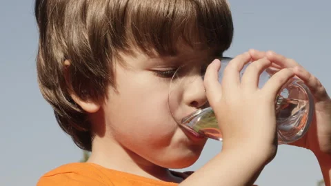 Thirsty Child Drinking Water From Glass ... | Stock Video | Pond5