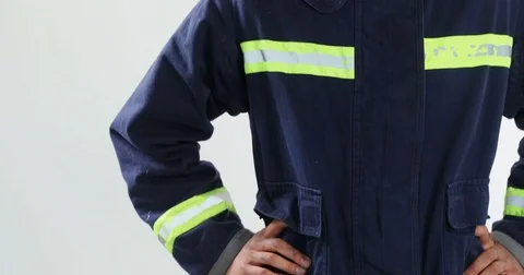 Thoughtful fireman looking up against wh... | Stock Video | Pond5